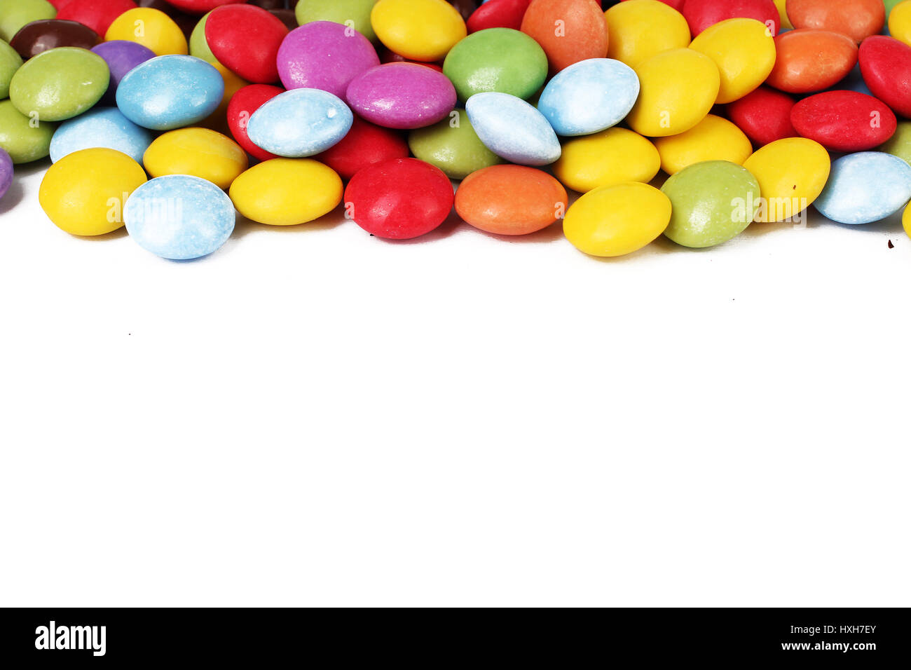 Shiny sugar coated round chocolate balls as background. Candy bonbons ...