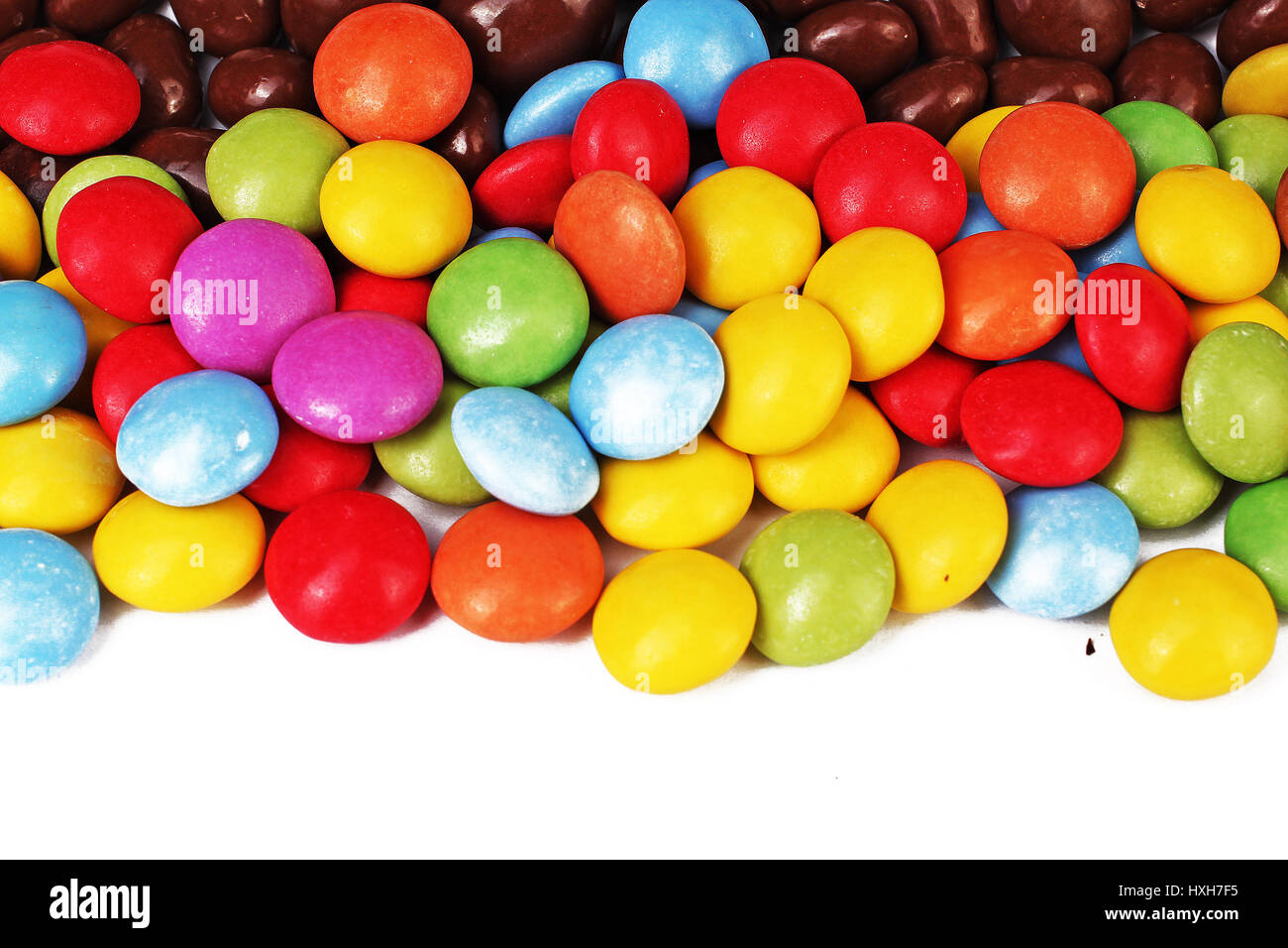 Shiny sugar coated round chocolate balls as background. Candy bonbons ...