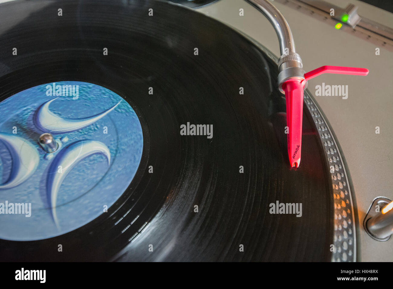 Playing vinyl on turntable Stock Photo - Alamy