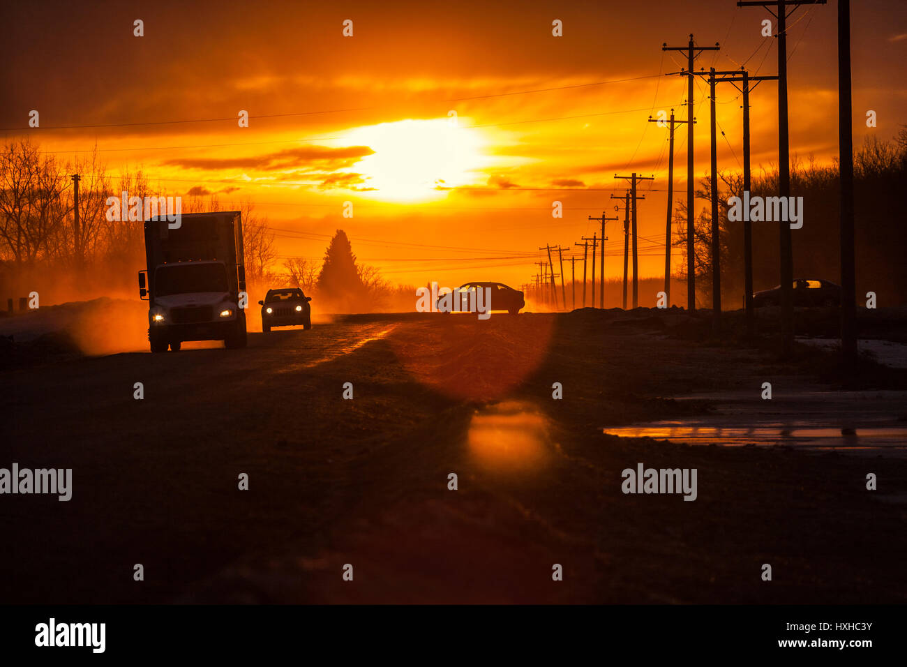 Sunrise traffic on the countryside road Stock Photo - Alamy