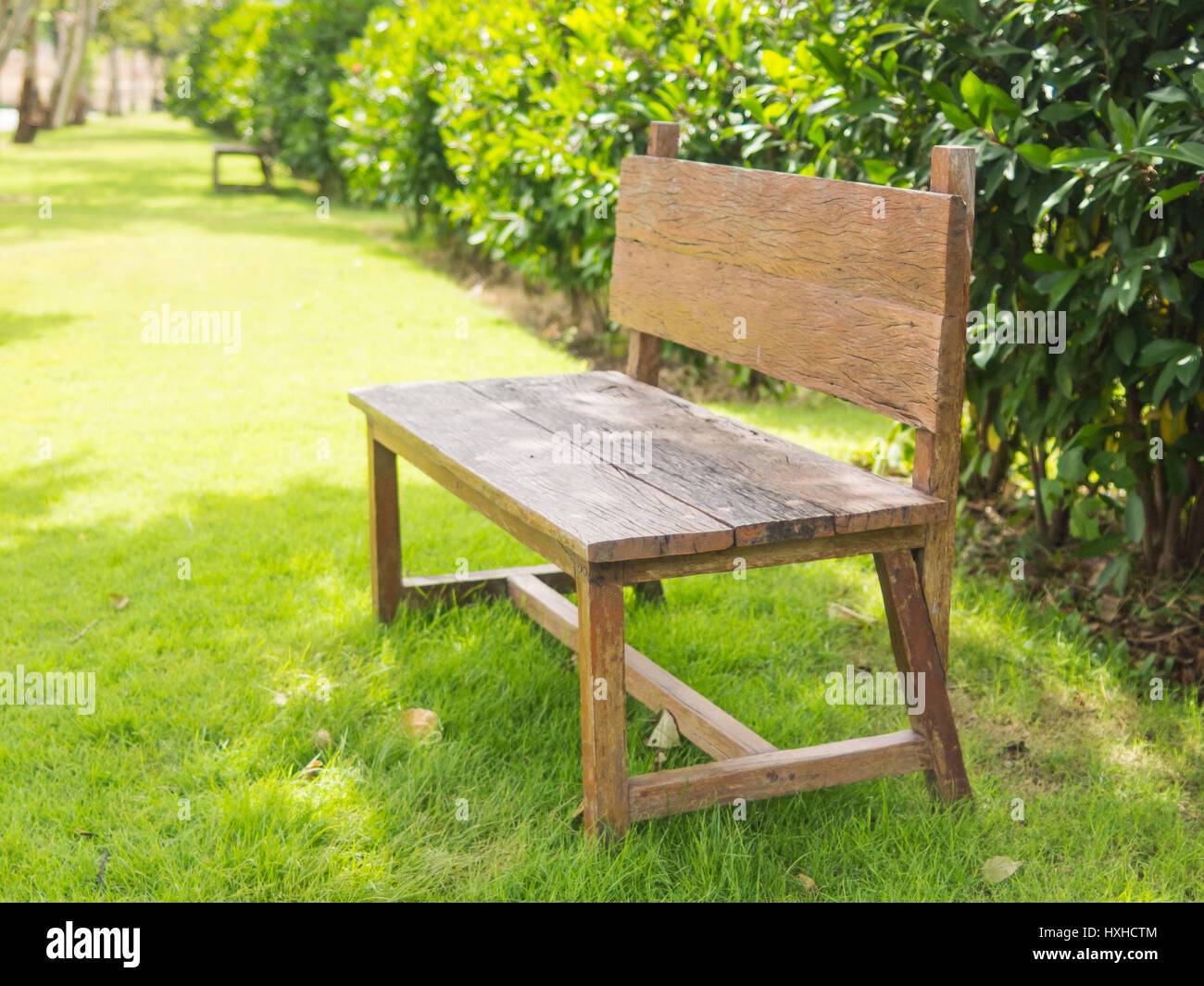Soft blur wooden bench in the park Stock Photo - Alamy