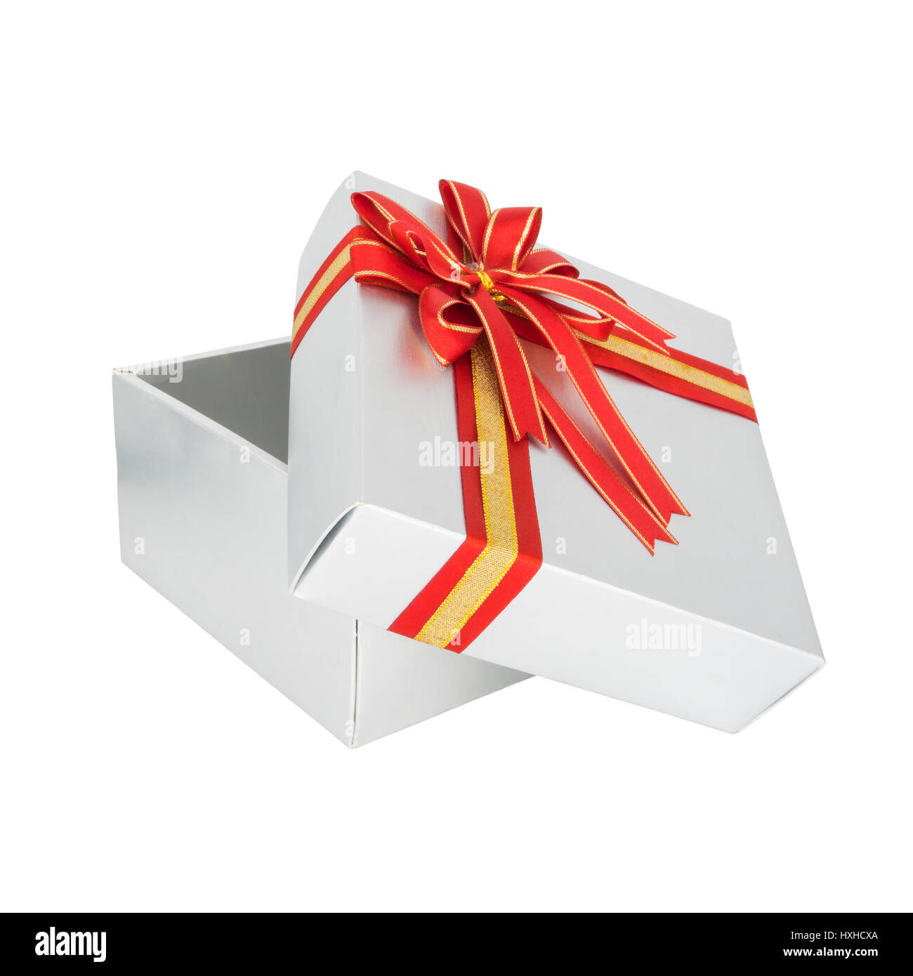 Silver gift box and red ribbon isolated on white background Stock Photo ...