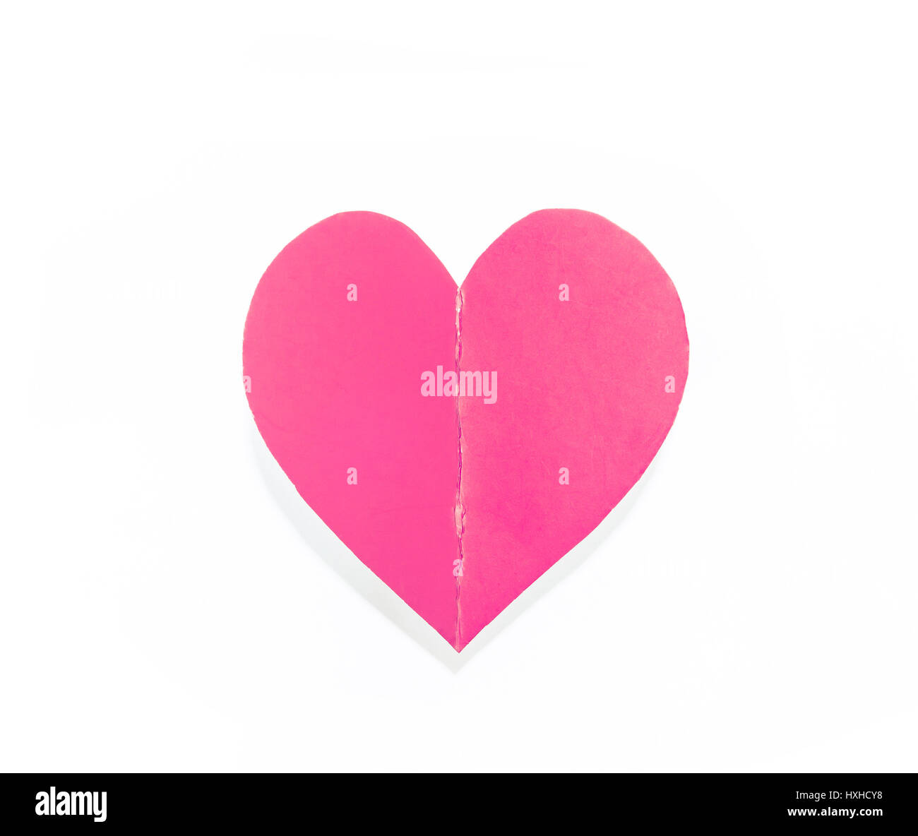 Pink paper heart with shadow isolated on white background Stock Photo ...
