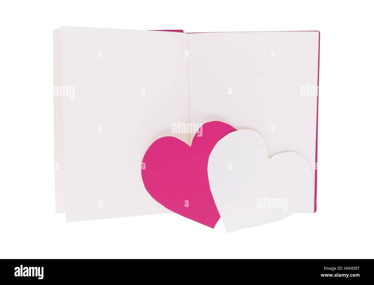 Pink and white paper heart on blank open book isolated on white ...