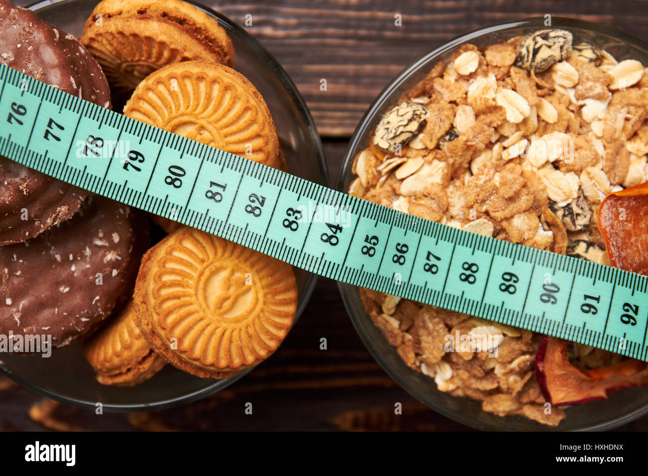 Muesli, cookies and measuring tape Stock Photo - Alamy