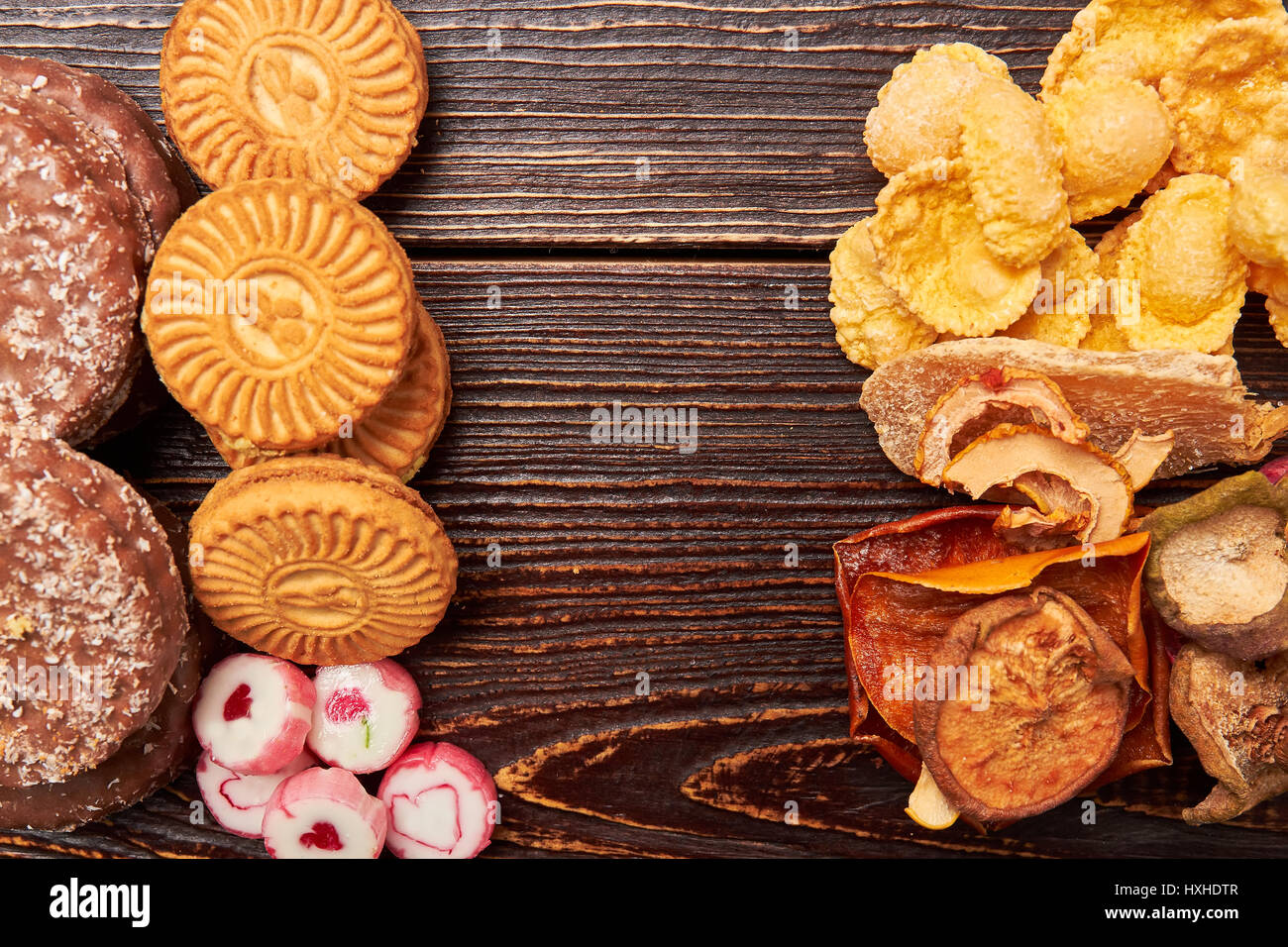 Healthy food against sweets Stock Photo - Alamy