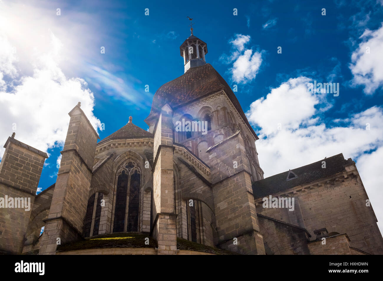 Stone walls and windows of a historic church viewed low angle looking ...