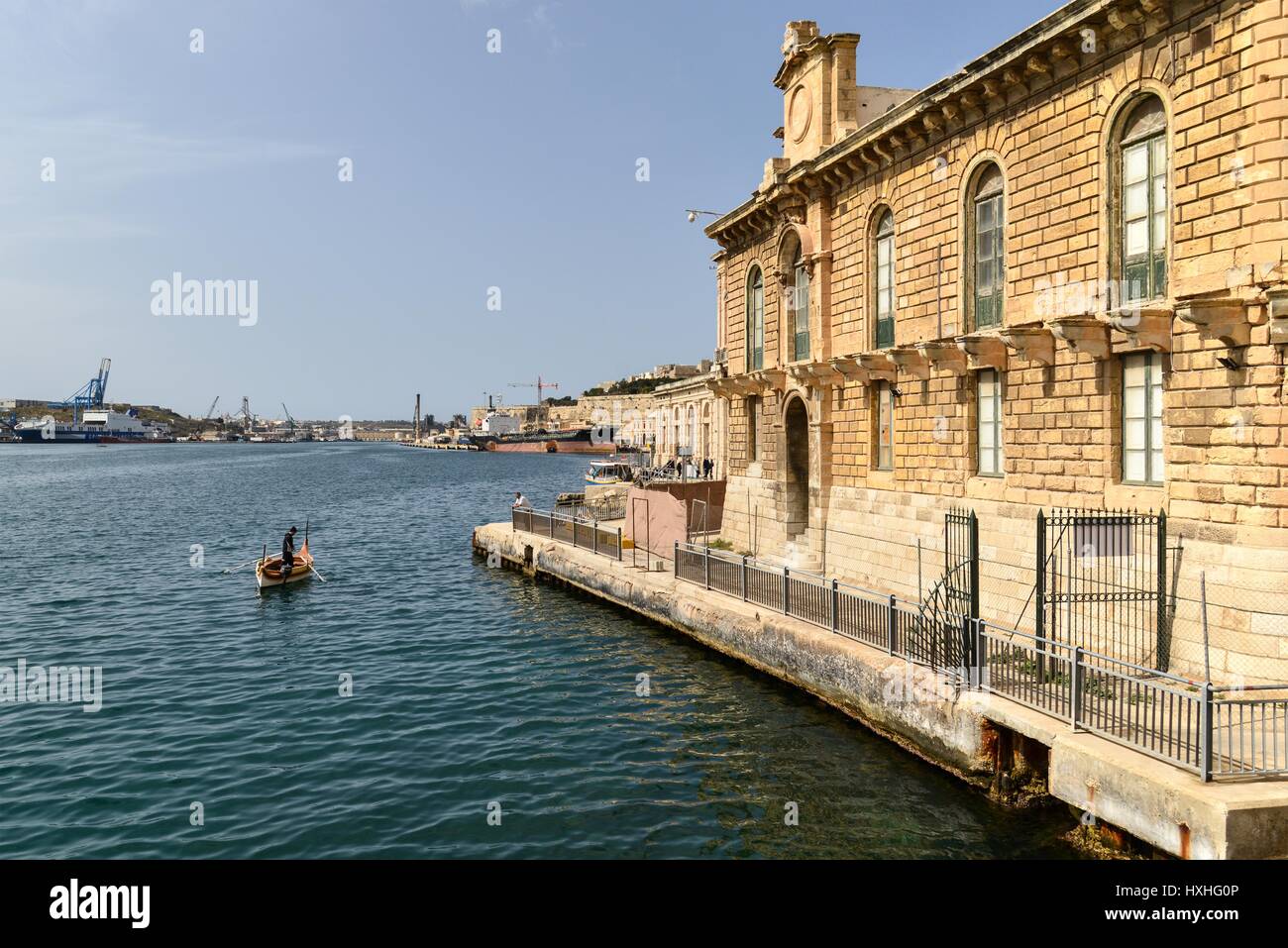Old Customs House and a dgħajsa, a traditional water taxi from Malta ...