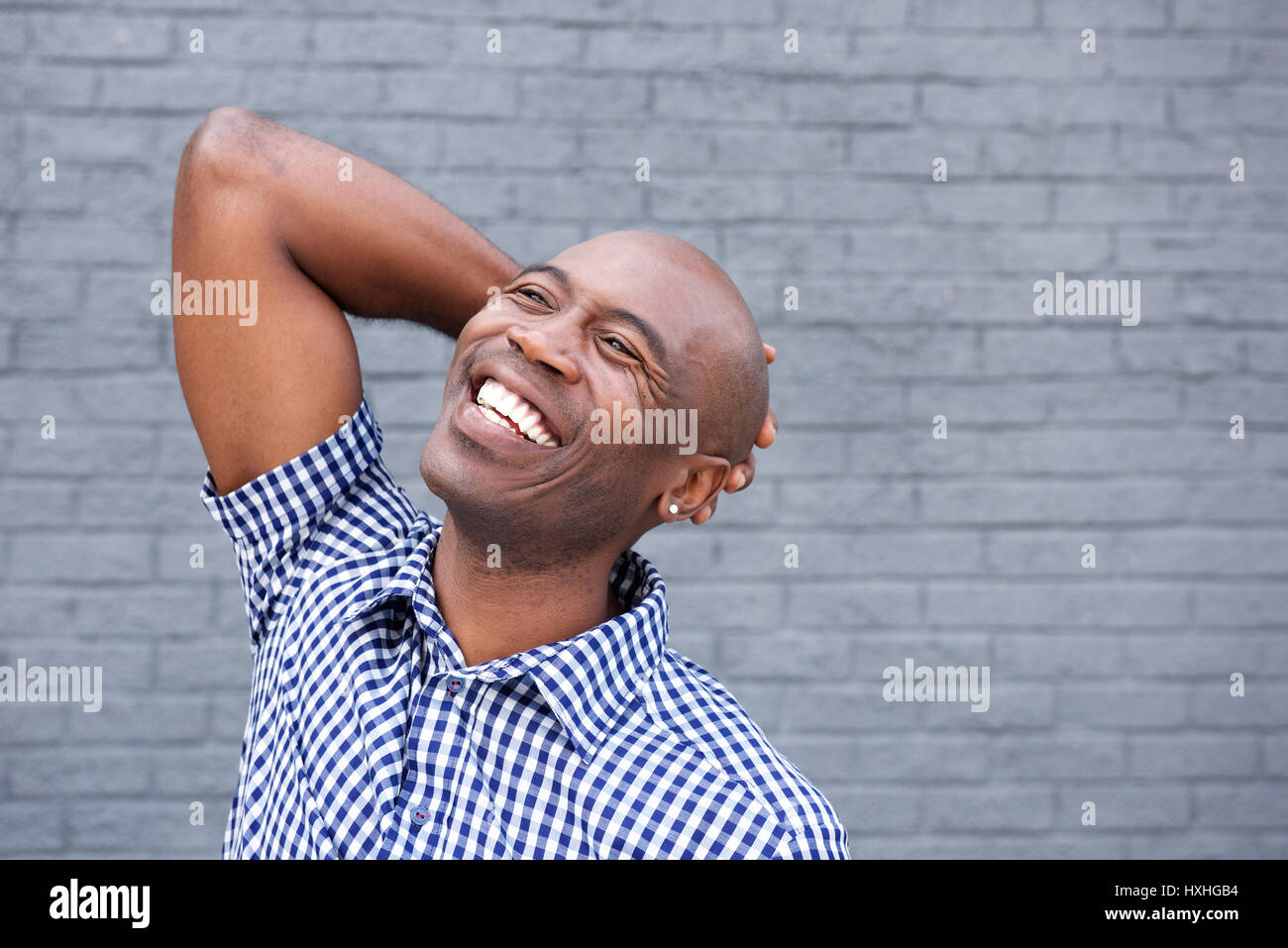 Close Up Portrait Of An African American Man Laughing And Looking Up