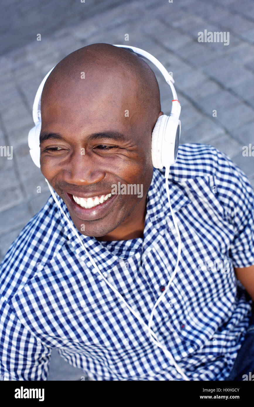Close Up Portrait Of A Happy African American Man Listening To Music