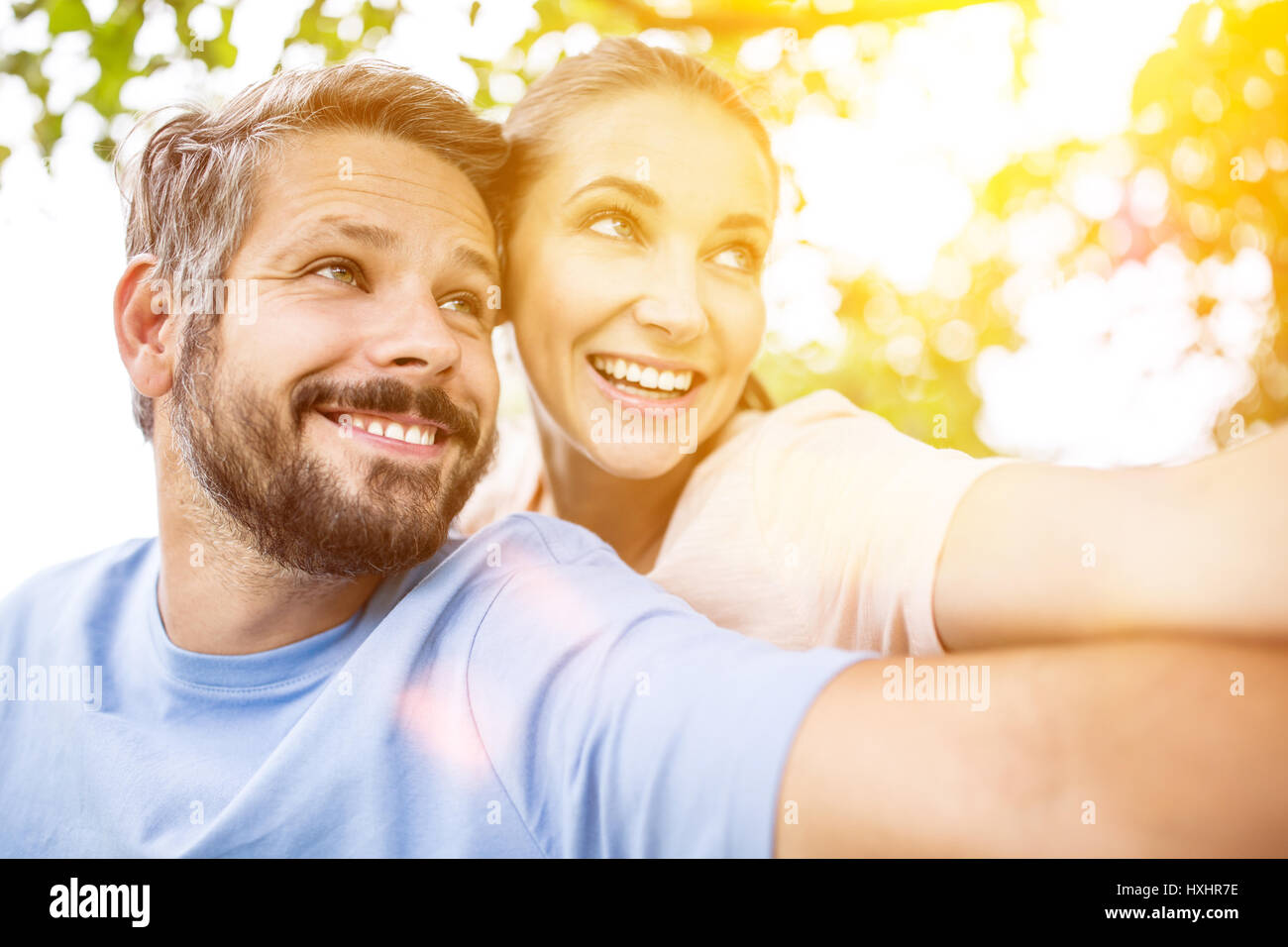 Happy couple together in summer having fun in the nature Stock Photo ...
