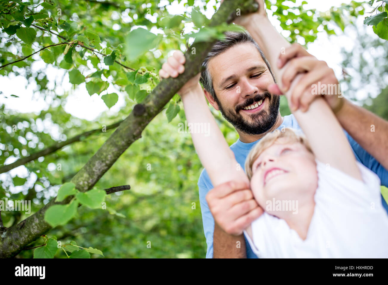 Father helps son hi-res stock photography and images - Alamy