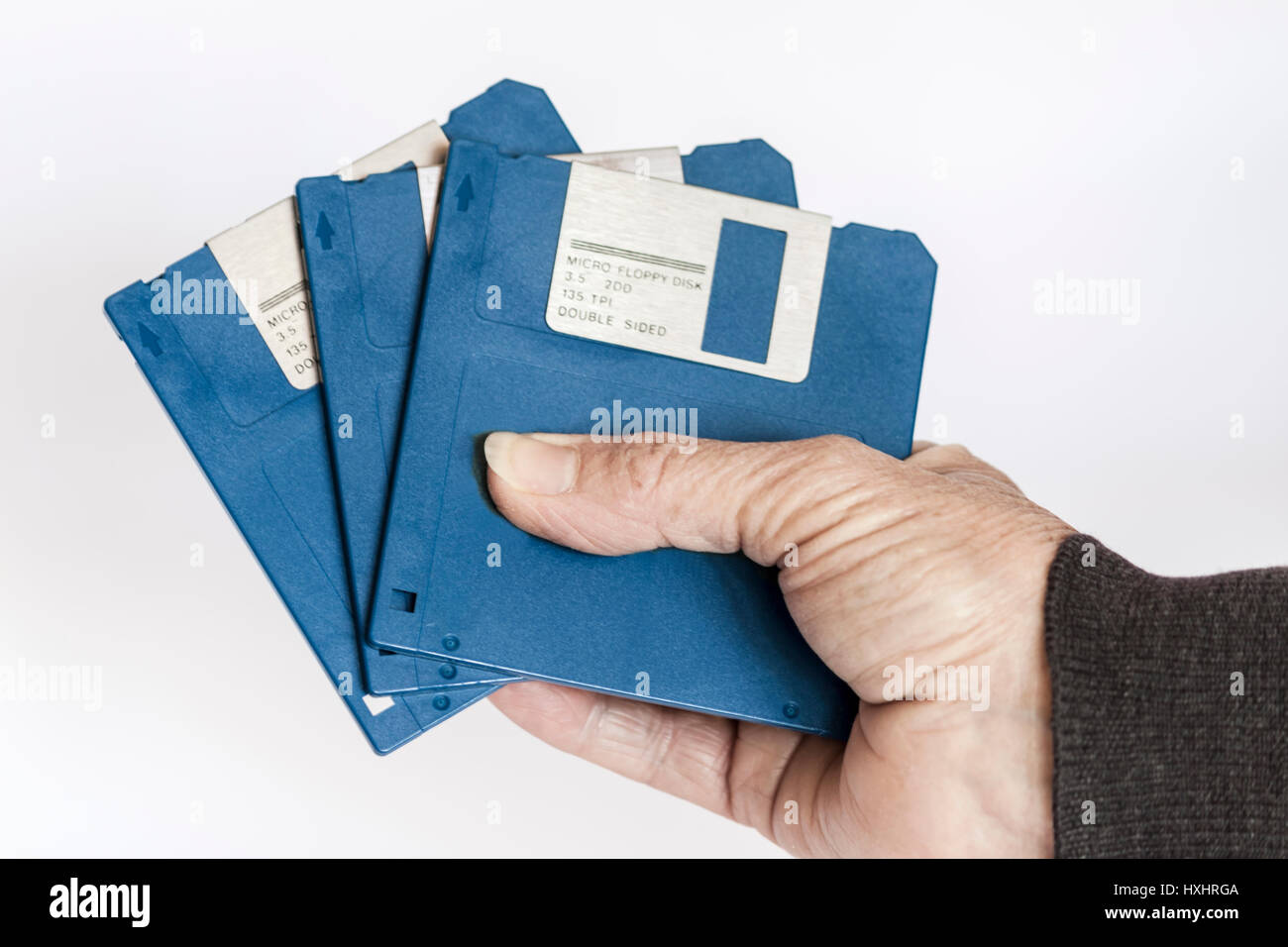 Hand of a woman holding floppy disks Stock Photo - Alamy