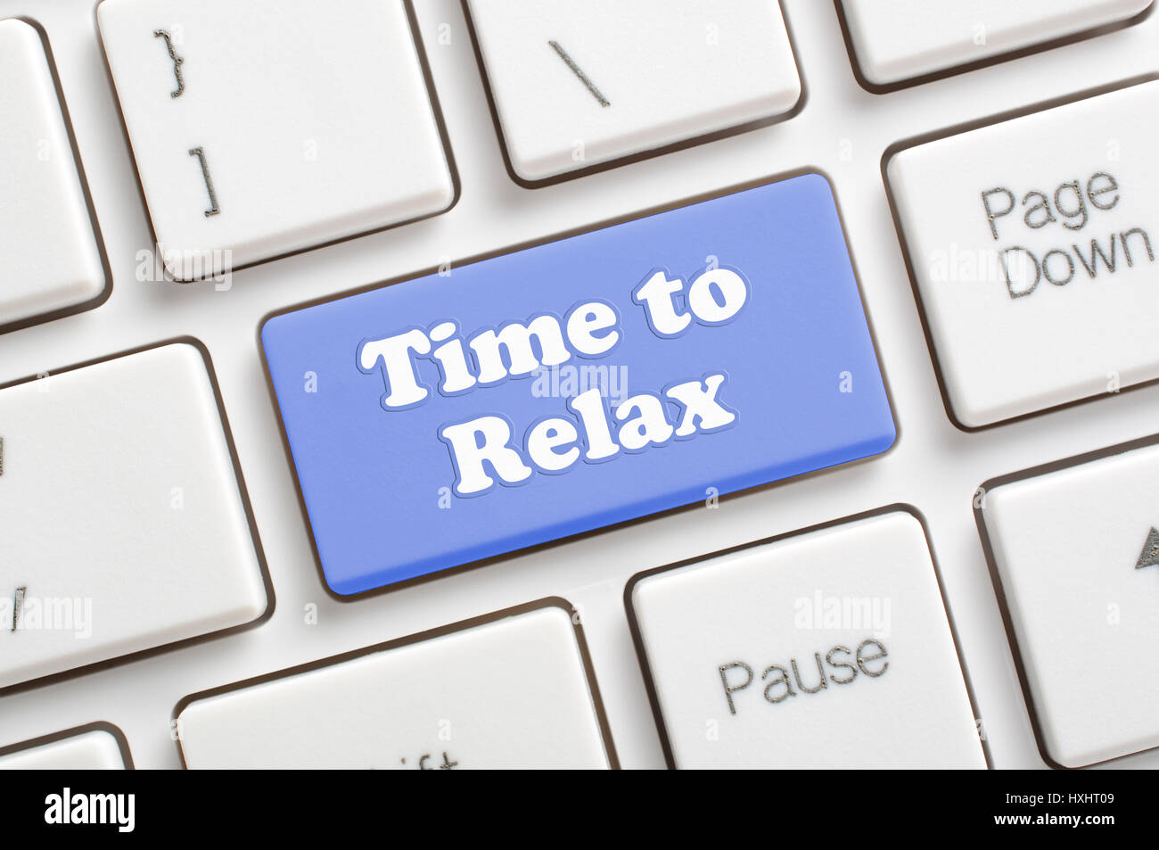 Blue time to relax key on keyboard Stock Photo - Alamy