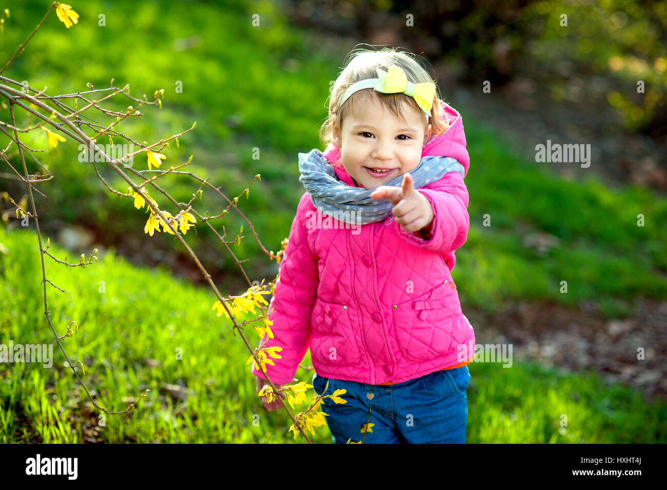 little girl in the spring garden Stock Photo - Alamy