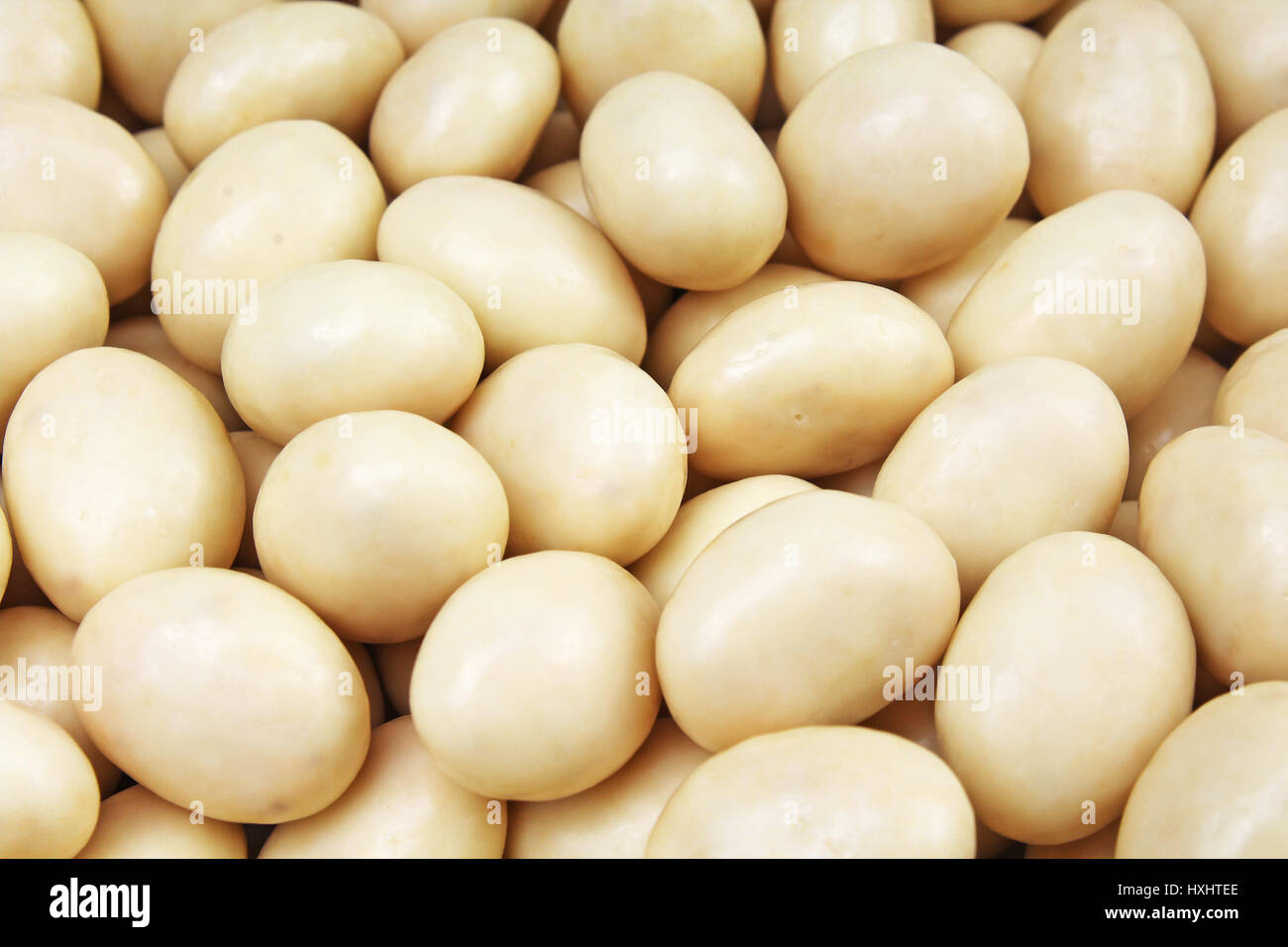 White chocolate balls. Chocolate drops as background texture pattern ...