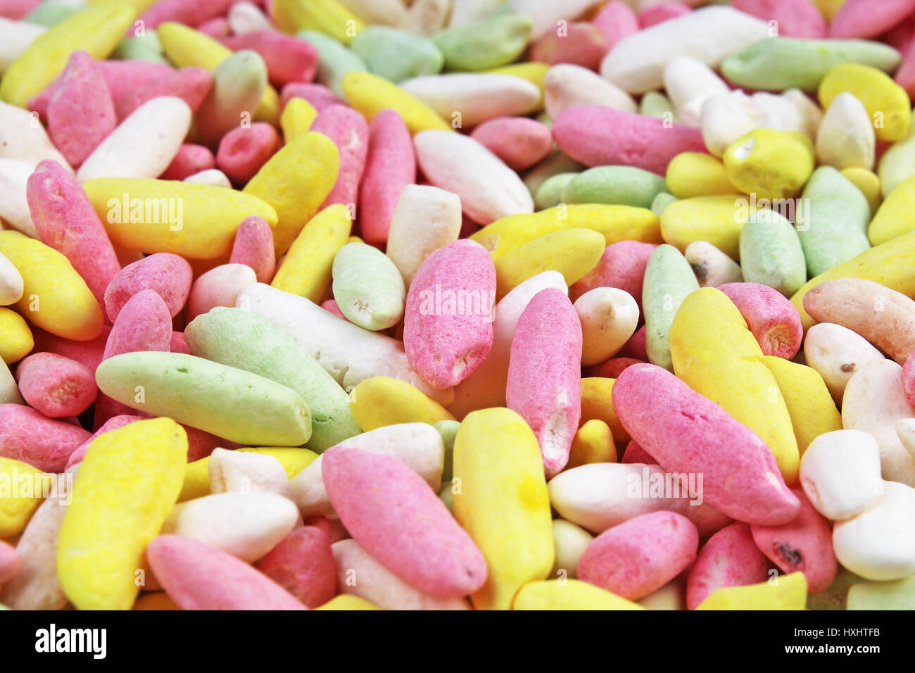 Candy from puffed rice grains. Sweet flavored puffed rice grains ...