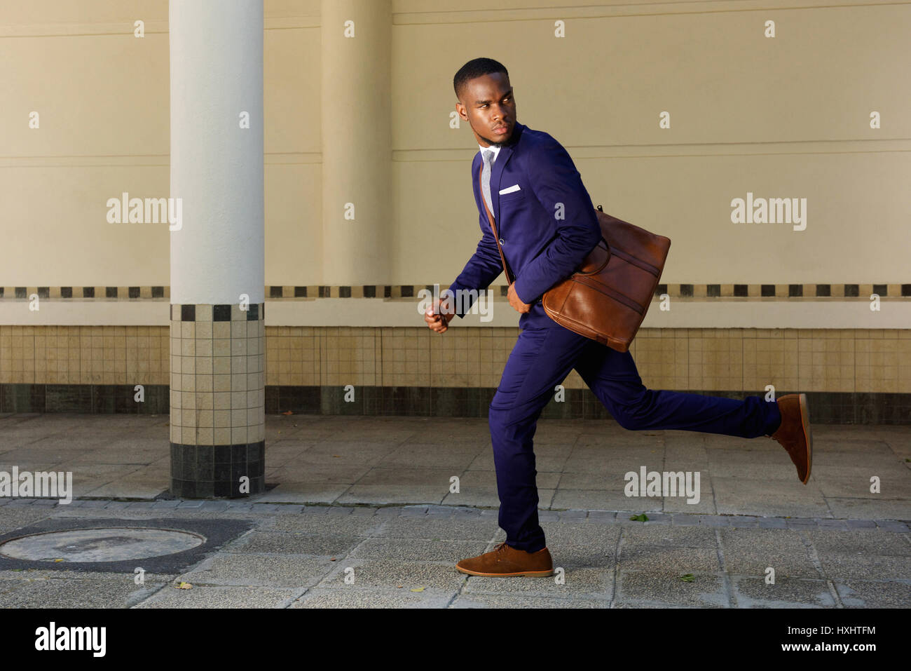 Man looking over shoulder running hi-res stock photography and images ...