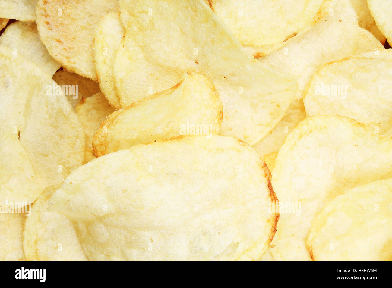 Chips pattern. Yellow salted potato chips as background. Chips texture ...