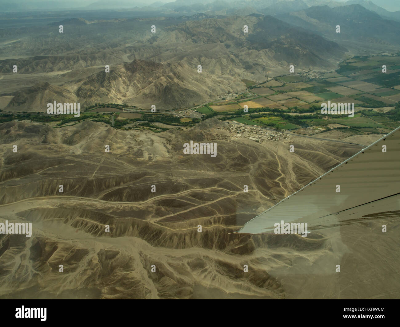 View for the Andes and Nazca line from the deck of small airplane Stock ...