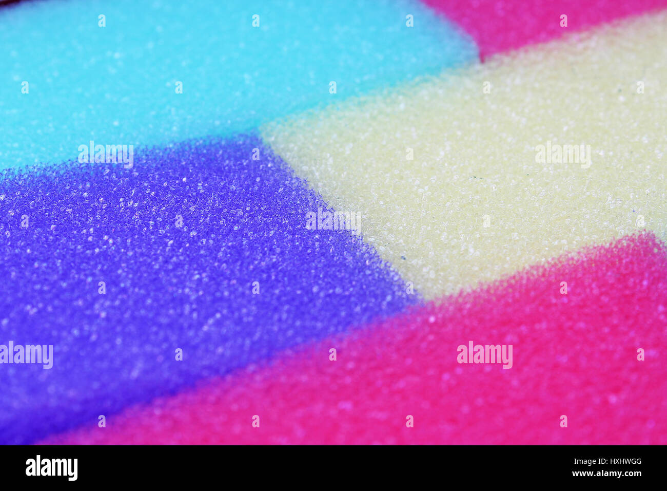 Cleaning kitchen sponge texture as background. Colorful yellow pink ...