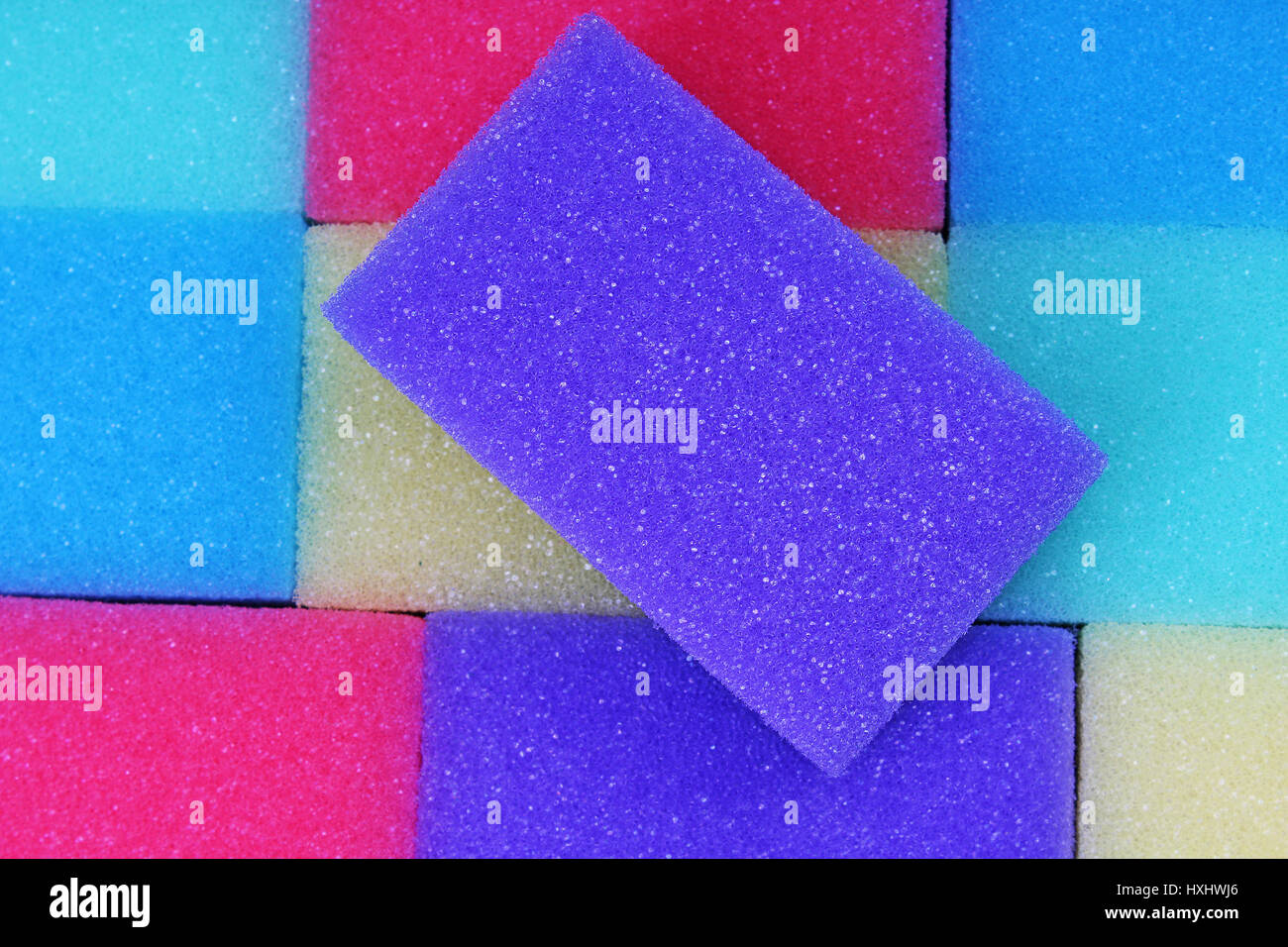 Cleaning kitchen sponge texture as background. Colorful yellow pink ...