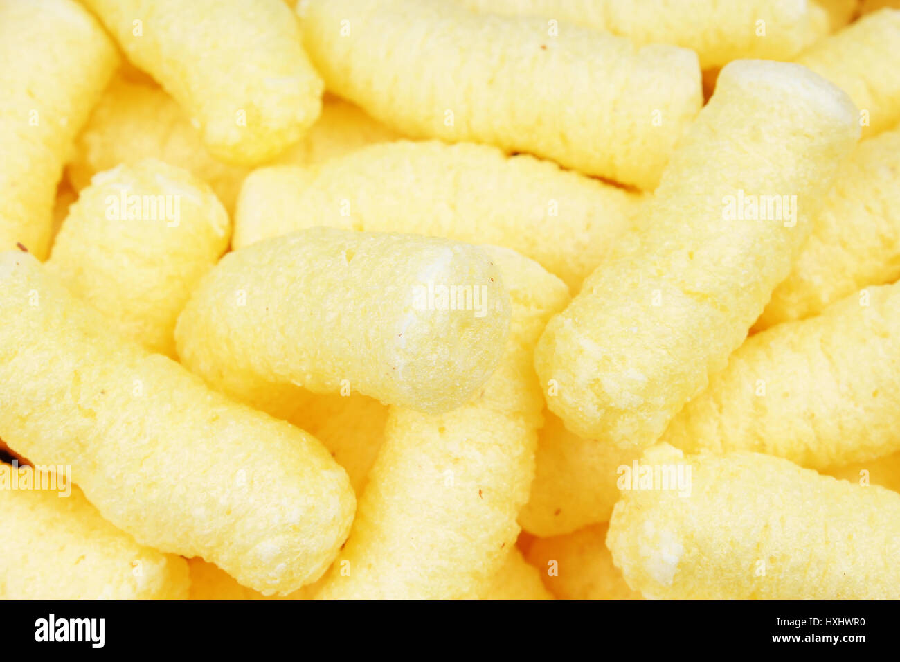 Cheese puff. Cheese puffs snack background texture food pattern Stock ...