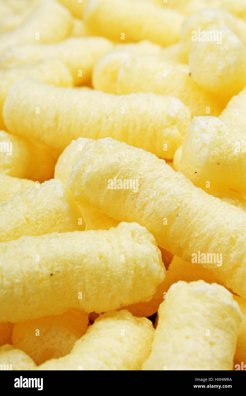 Cheese puff. Cheese puffs snack background texture food pattern Stock ...