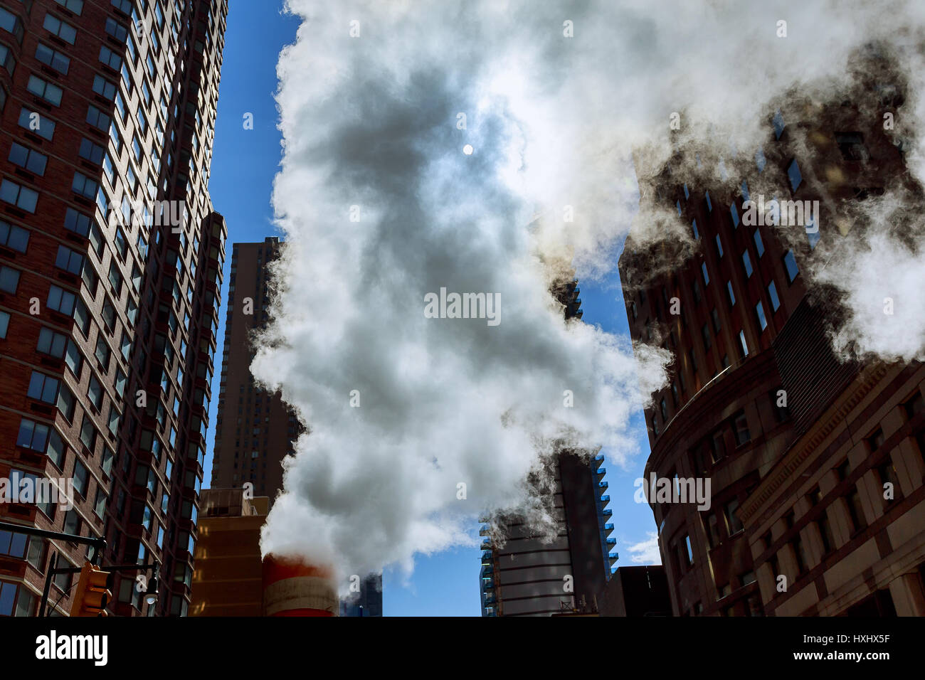 Steam pipe releasing hot air into the street in Midtown Manhattan. air ...