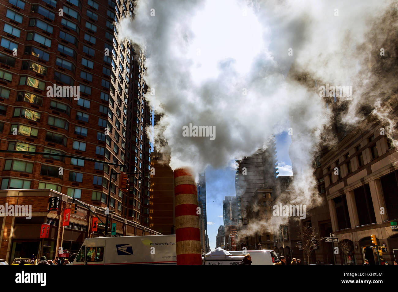 Steam pipe releasing hot air into the street in Midtown Manhattan. air ...