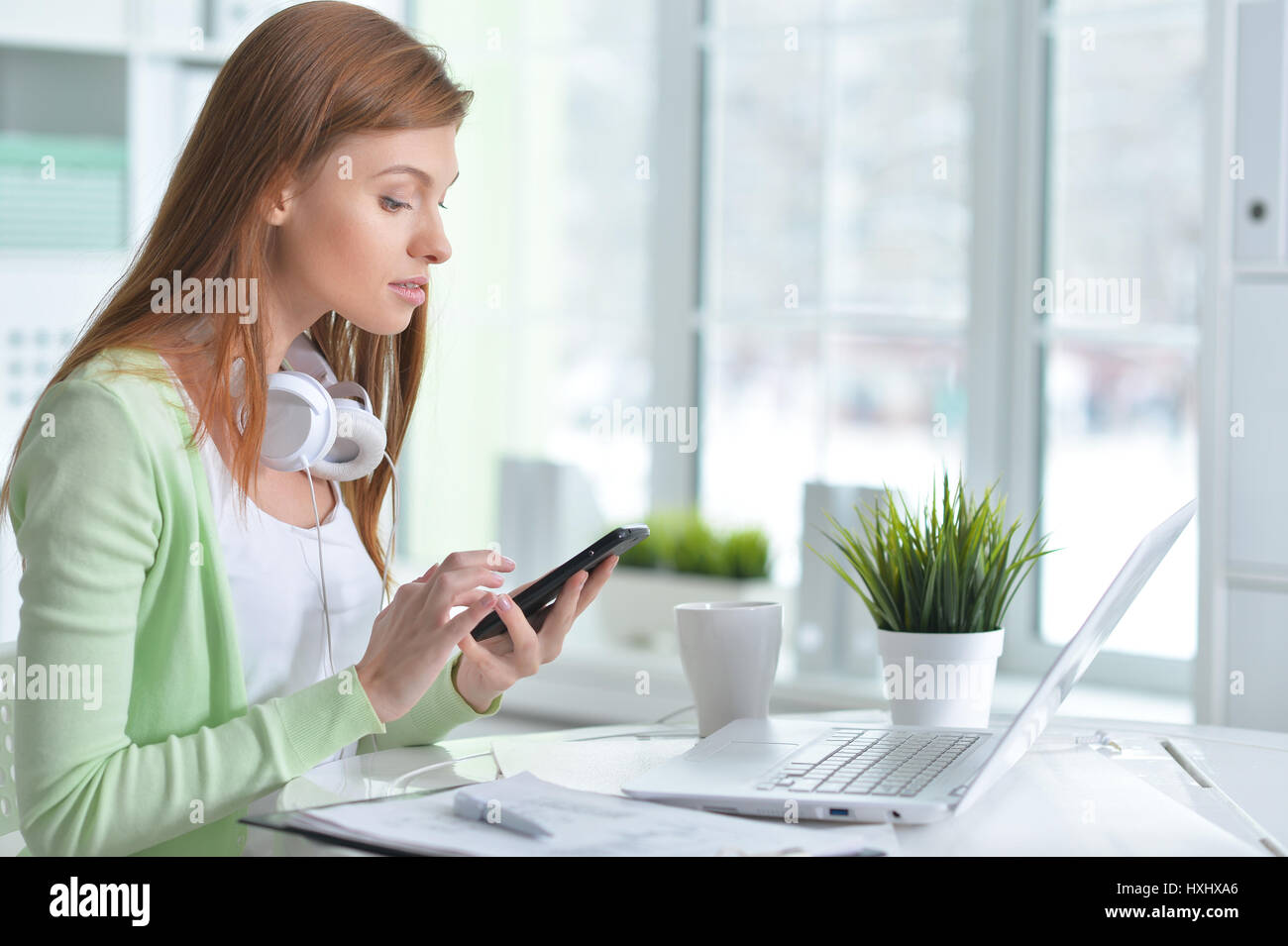 Beautiful girl working at a laptop Stock Photo - Alamy