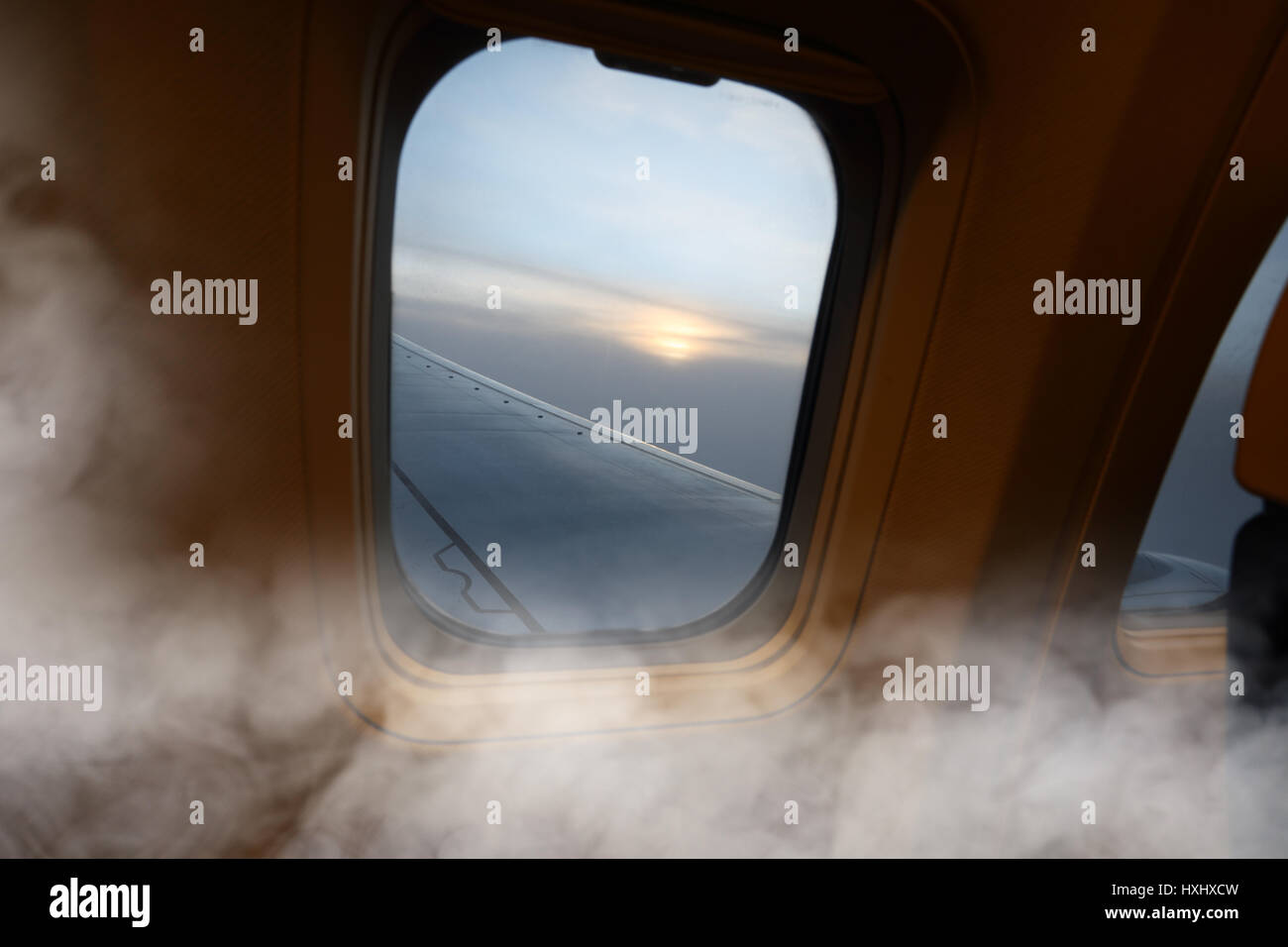 Smoke in the cabin of the passenger plane Stock Photo - Alamy
