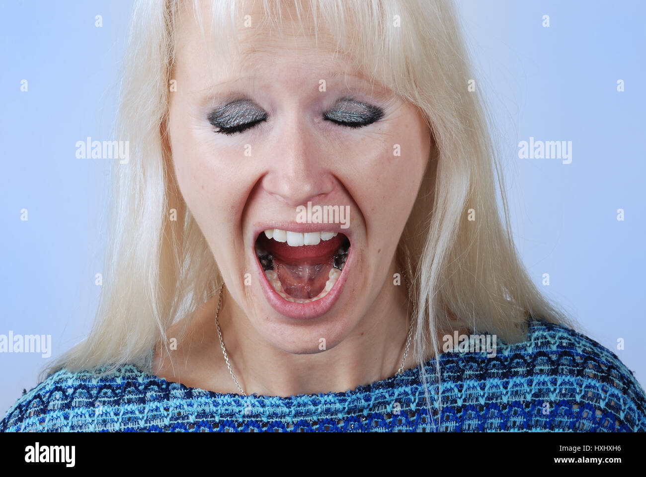 Young blonde woman with a cry Stock Photo - Alamy