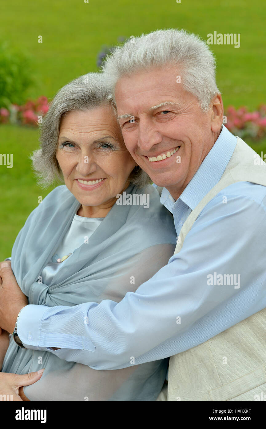 Happy elderly couple embracing Stock Photo - Alamy