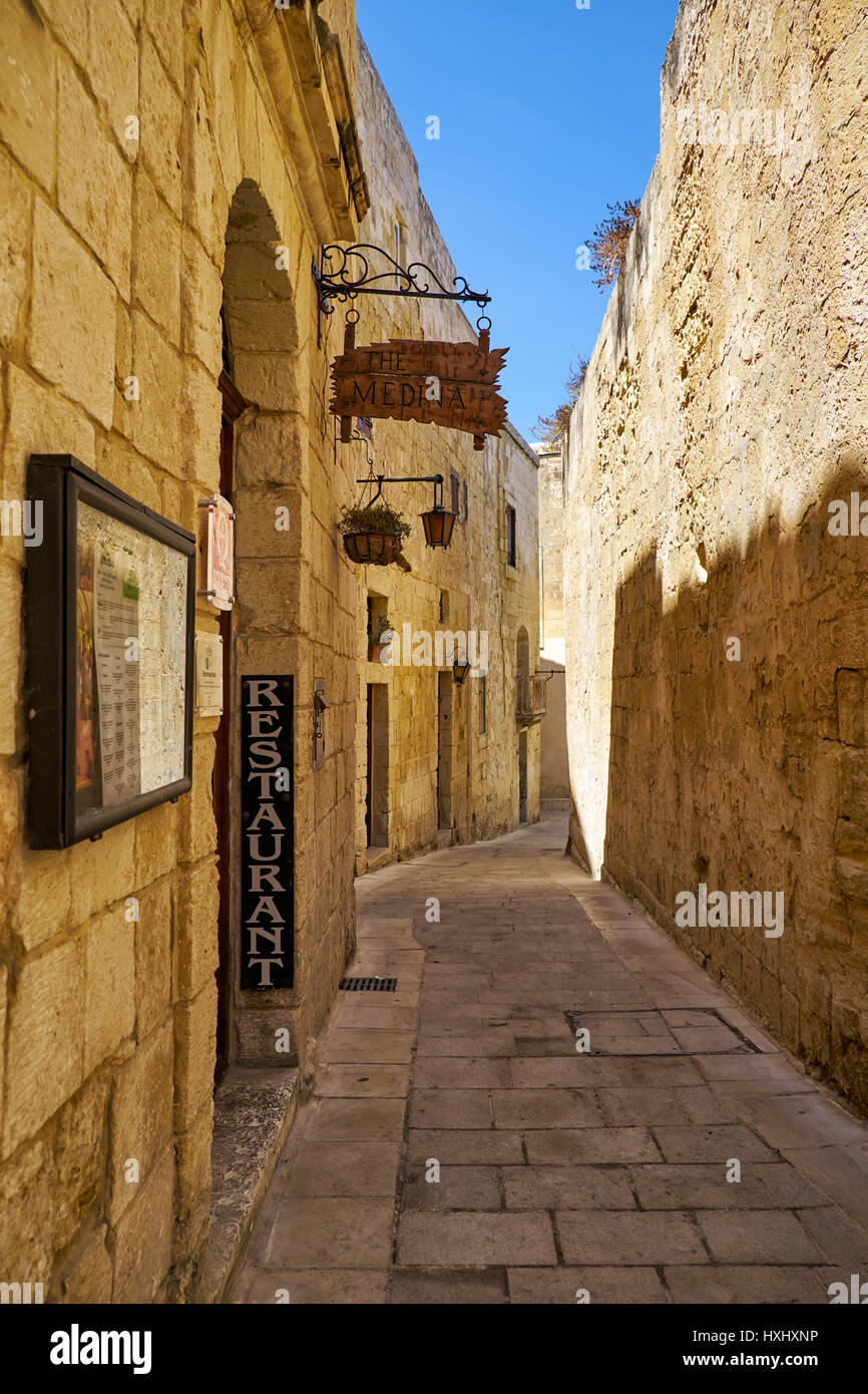 MDINA, MALTA - JULY 29, 2015: The narrow medieval stone paved street ...