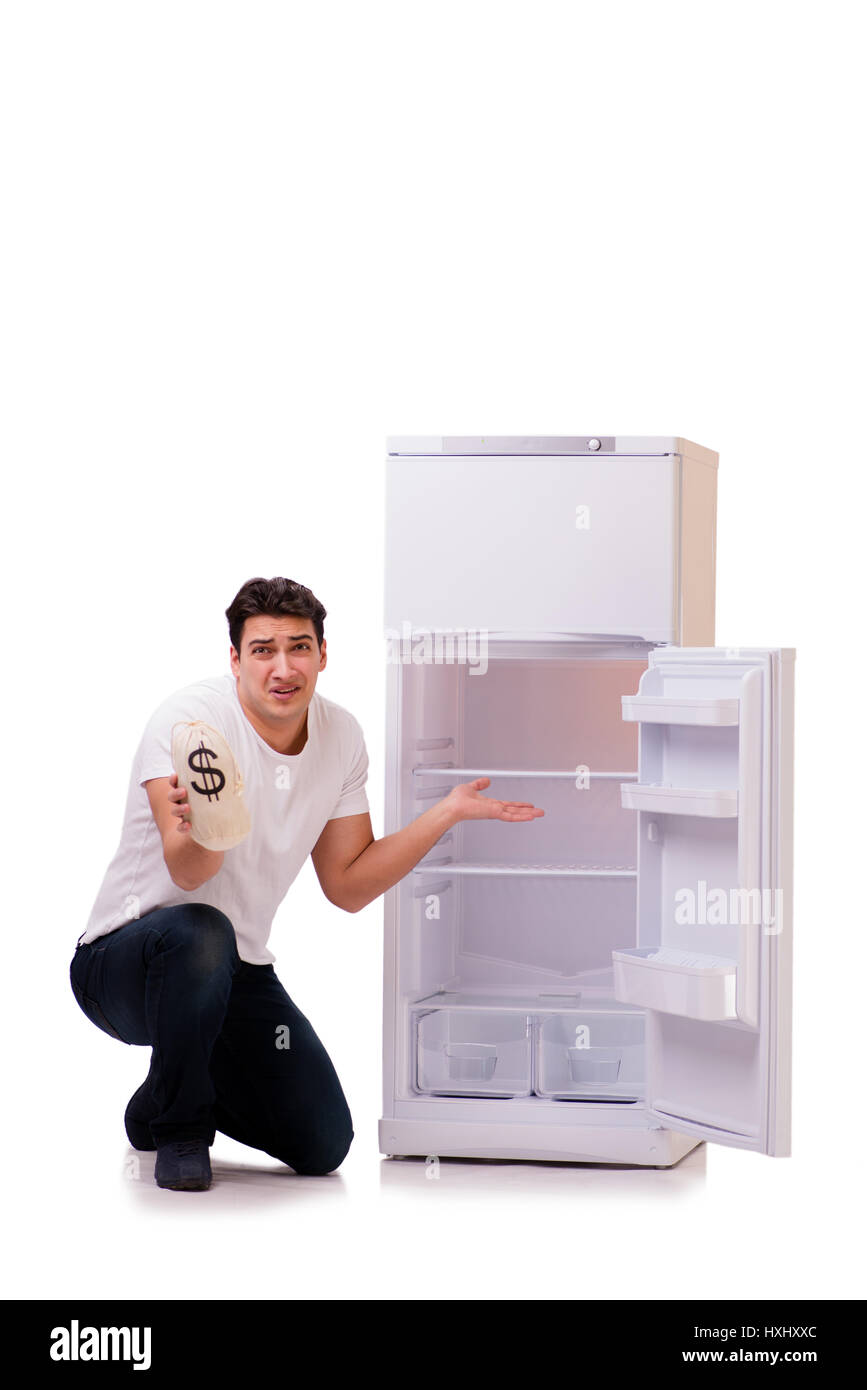 Hungry man looking for money to fill the fridge Stock Photo - Alamy