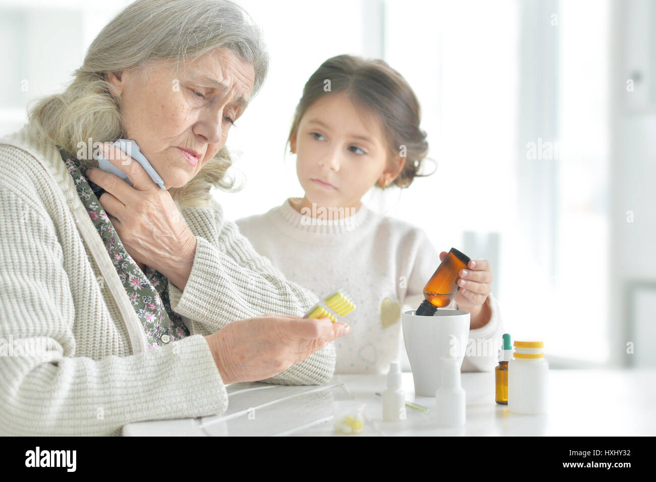 Granddaughter takes care of a sick grandmother Stock Photo - Alamy