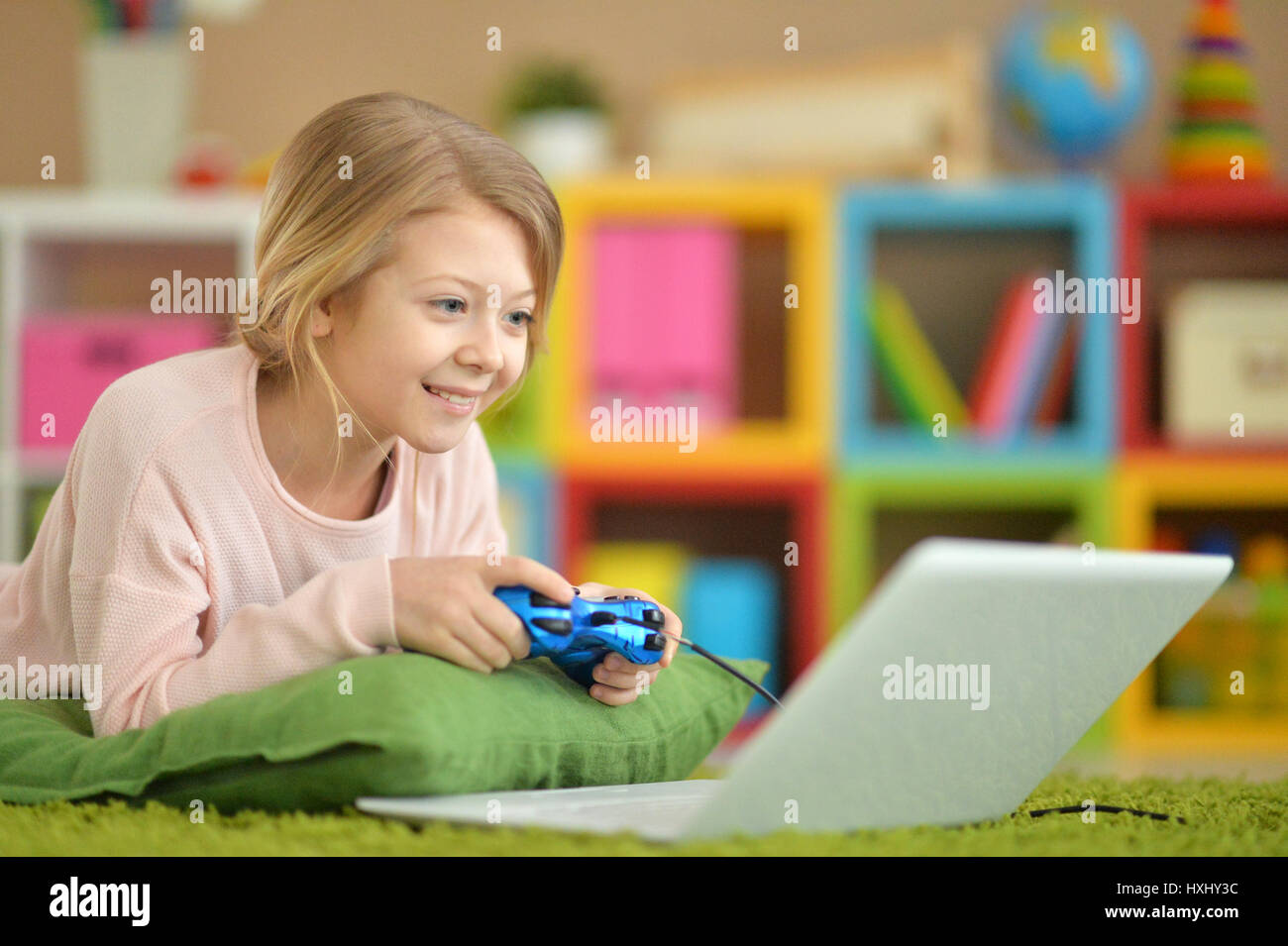 Girl is playing a computer game Stock Photo - Alamy