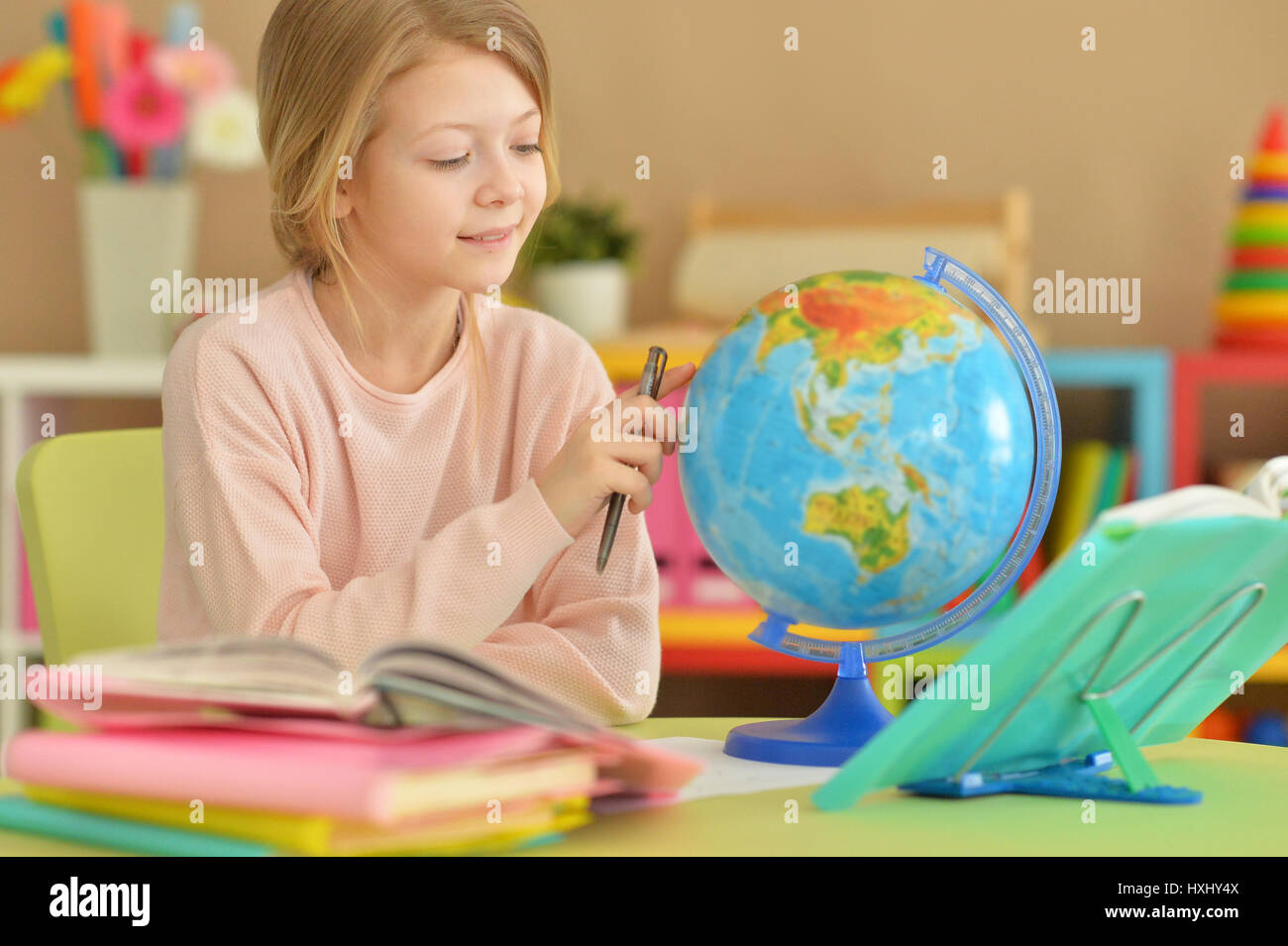 Cute girl does lessons Stock Photo - Alamy