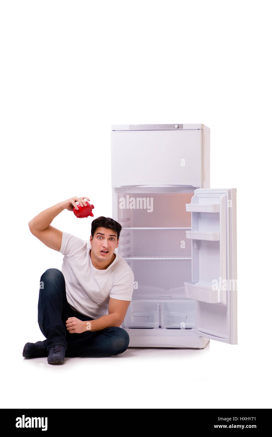 Hungry man looking for money to fill the fridge Stock Photo - Alamy