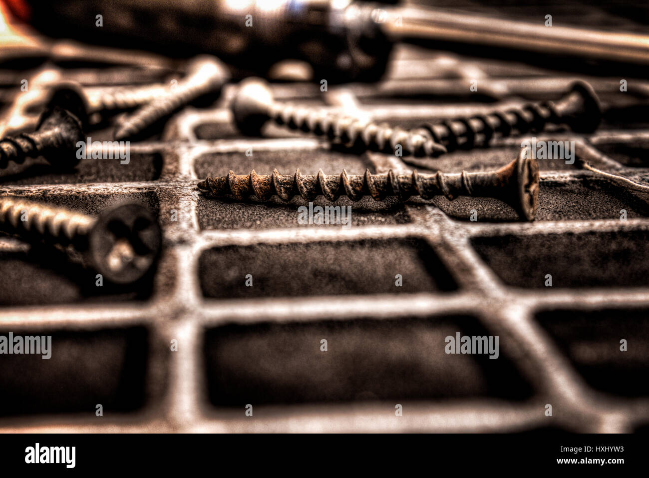 screwdriver and screws on wooden background Stock Photo - Alamy