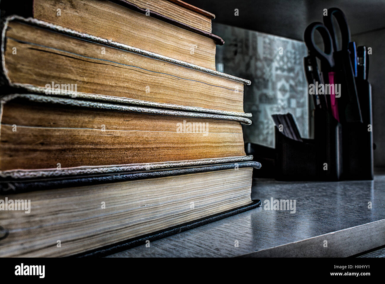 Books on the table. No labels, blank spine Stock Photo - Alamy