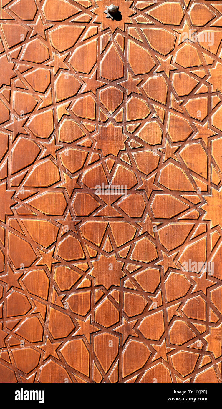 A beautiful ornament on a red stone photographed in close-up Stock ...