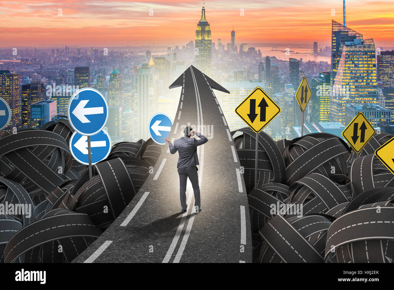 Businessman in uncertainty concept on road intersection crossroads ...