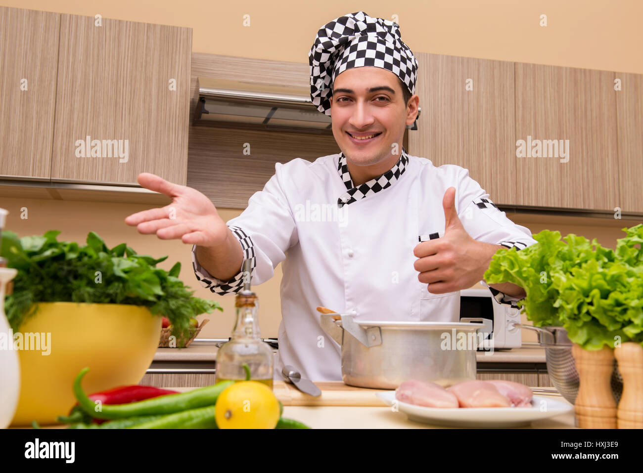 Young chef working in the kitchen Stock Photo - Alamy
