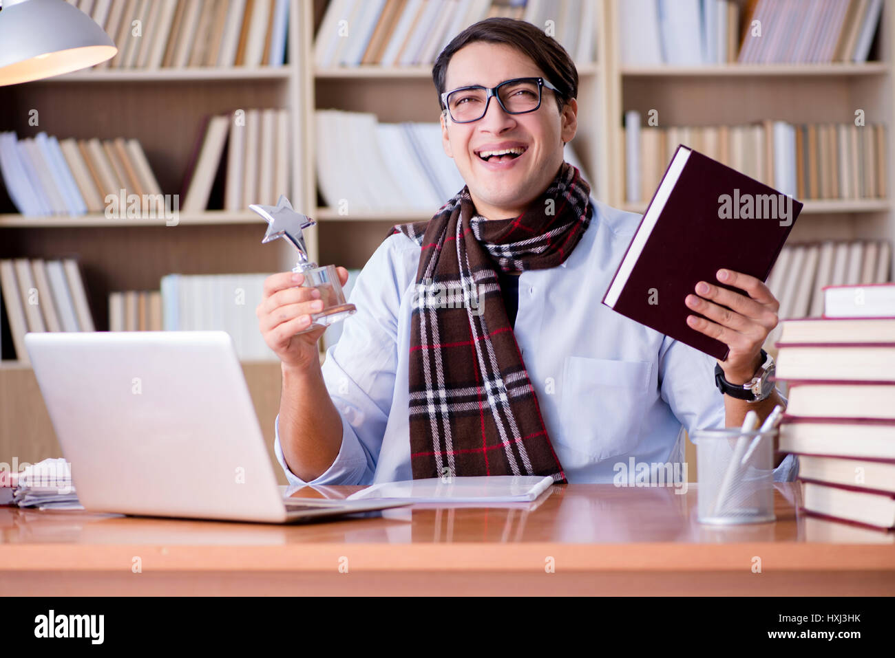Young writer working in the library Stock Photo - Alamy