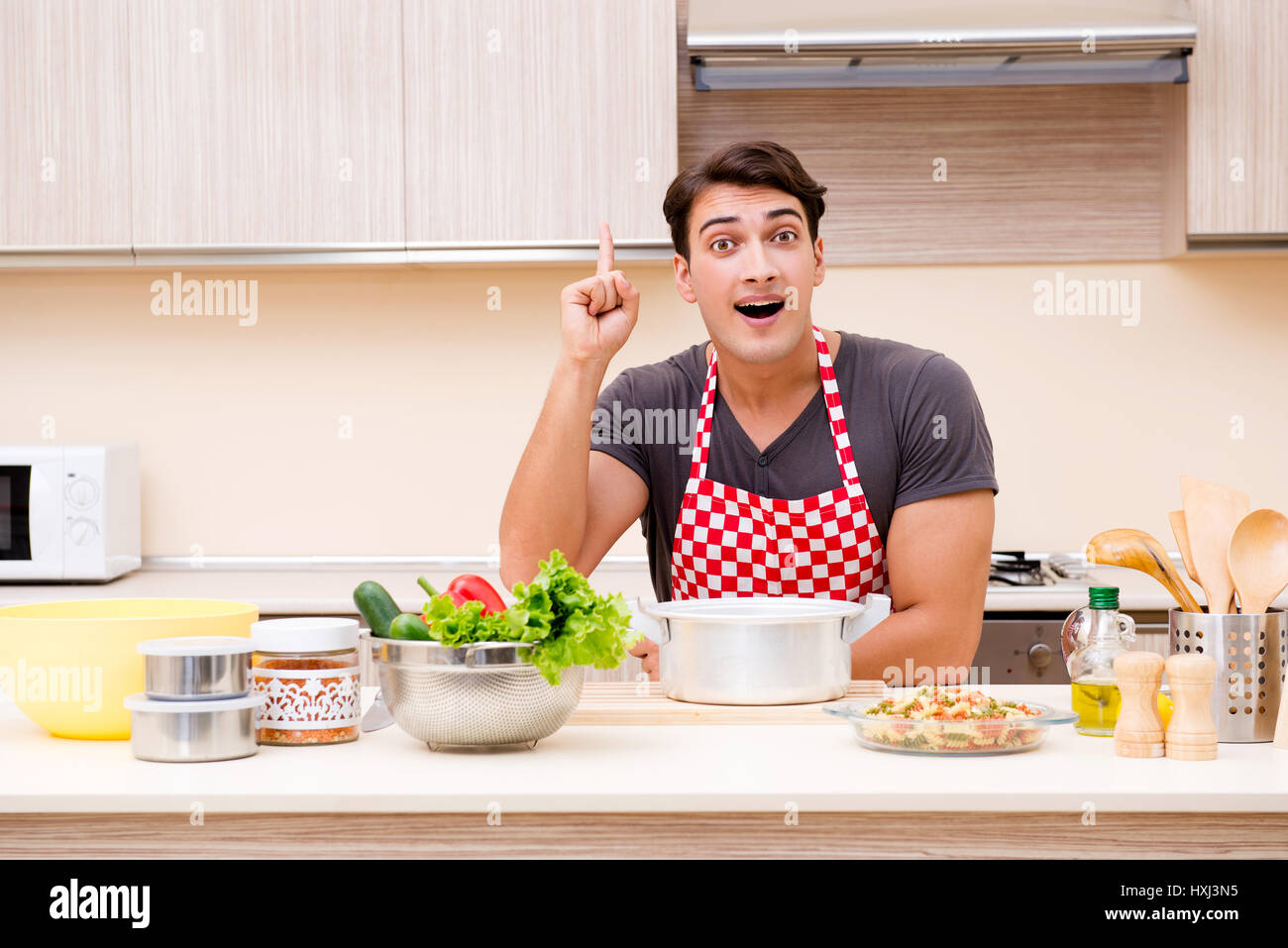 Man male cook preparing food in kitchen Stock Photo - Alamy