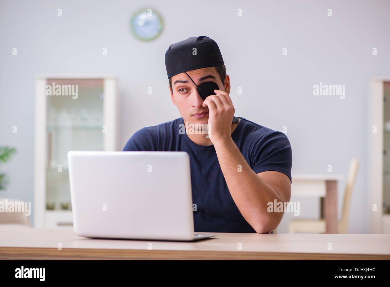 Digital security concept with pirate at computer Stock Photo - Alamy