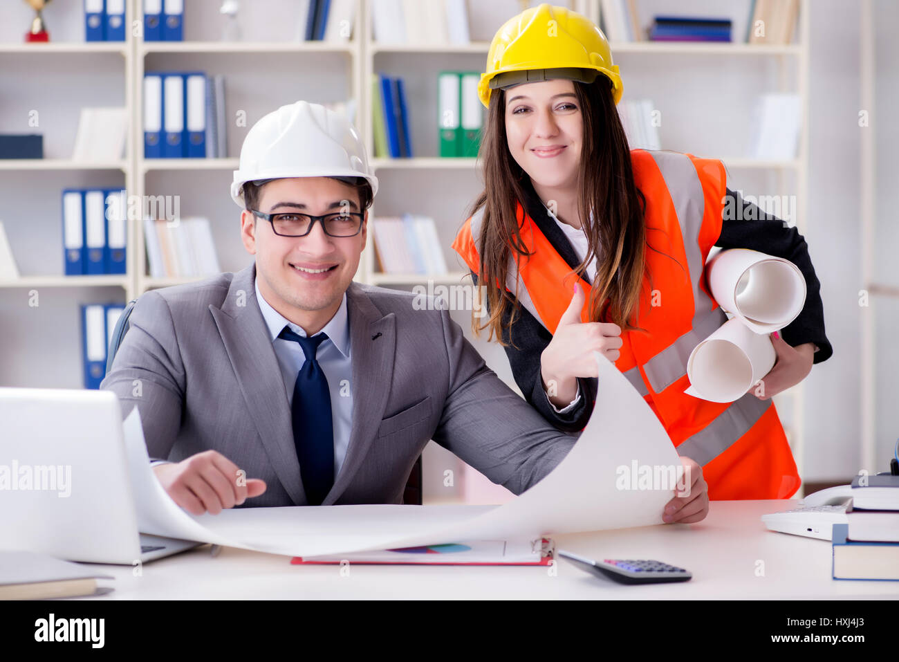 Construction foreman supervisor reviewing drawings Stock Photo - Alamy