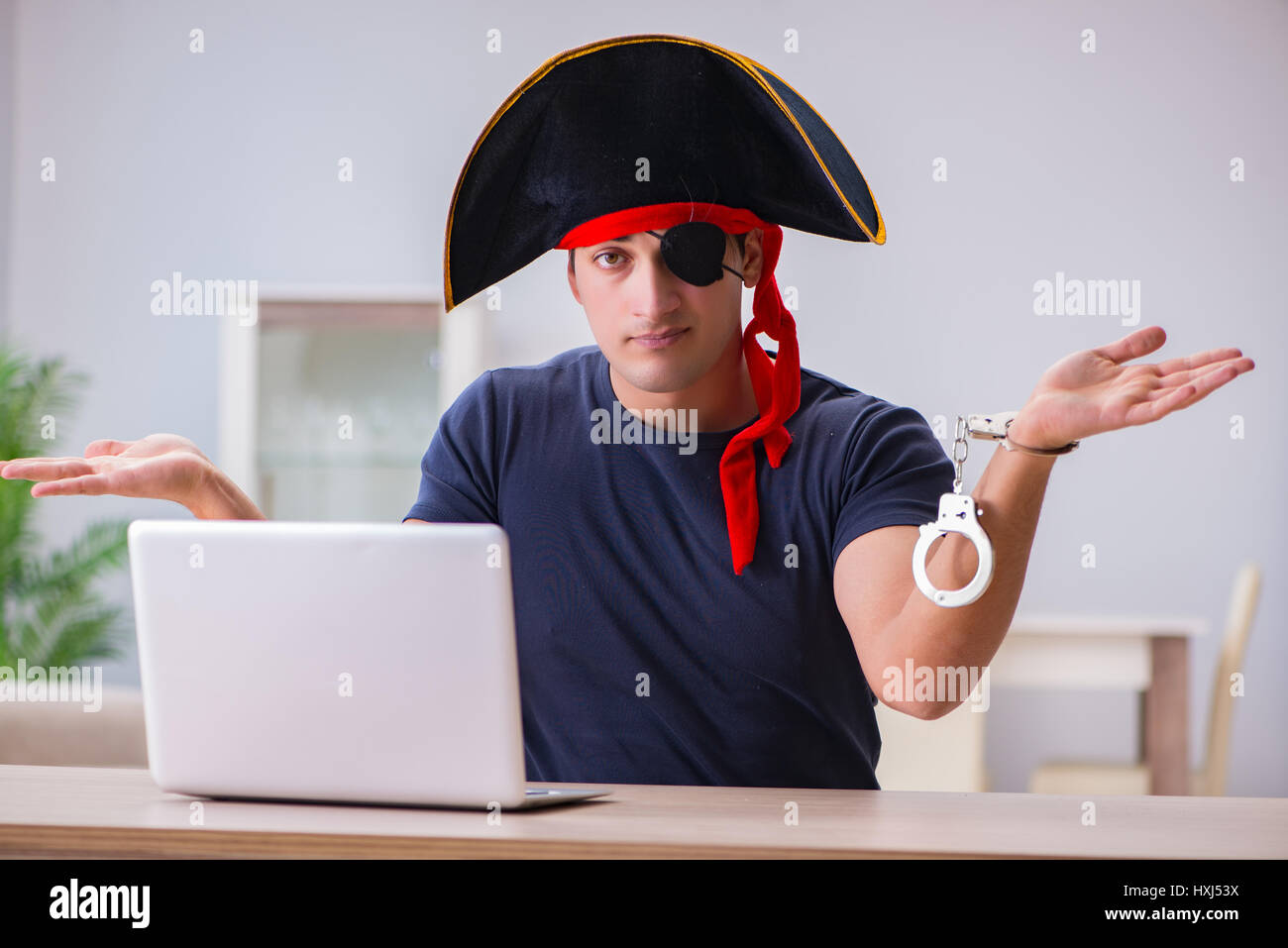 Digital security concept with pirate at computer Stock Photo - Alamy